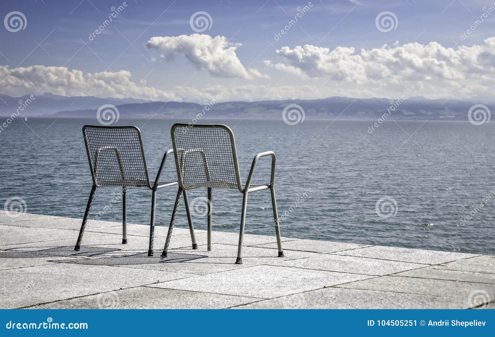 Two empty metallic chairs stock image. Image of calm - 104505251