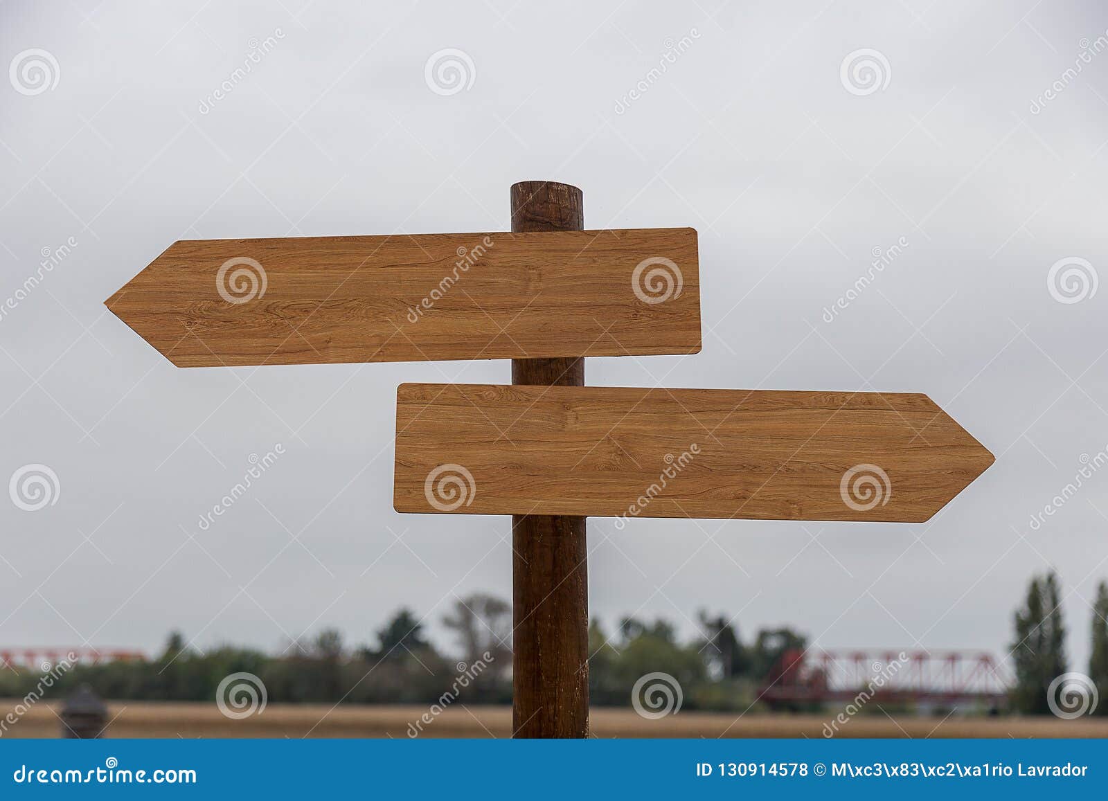 Two Empty Wooden Signs on a Pole Outside, Under a Pale Sky Stock Photo ...