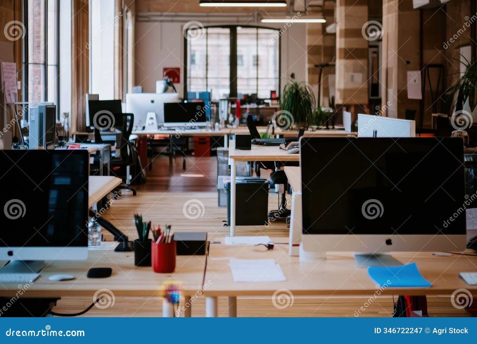 Two Workstations In A Modern Office With Large Windows Royalty-Free ...