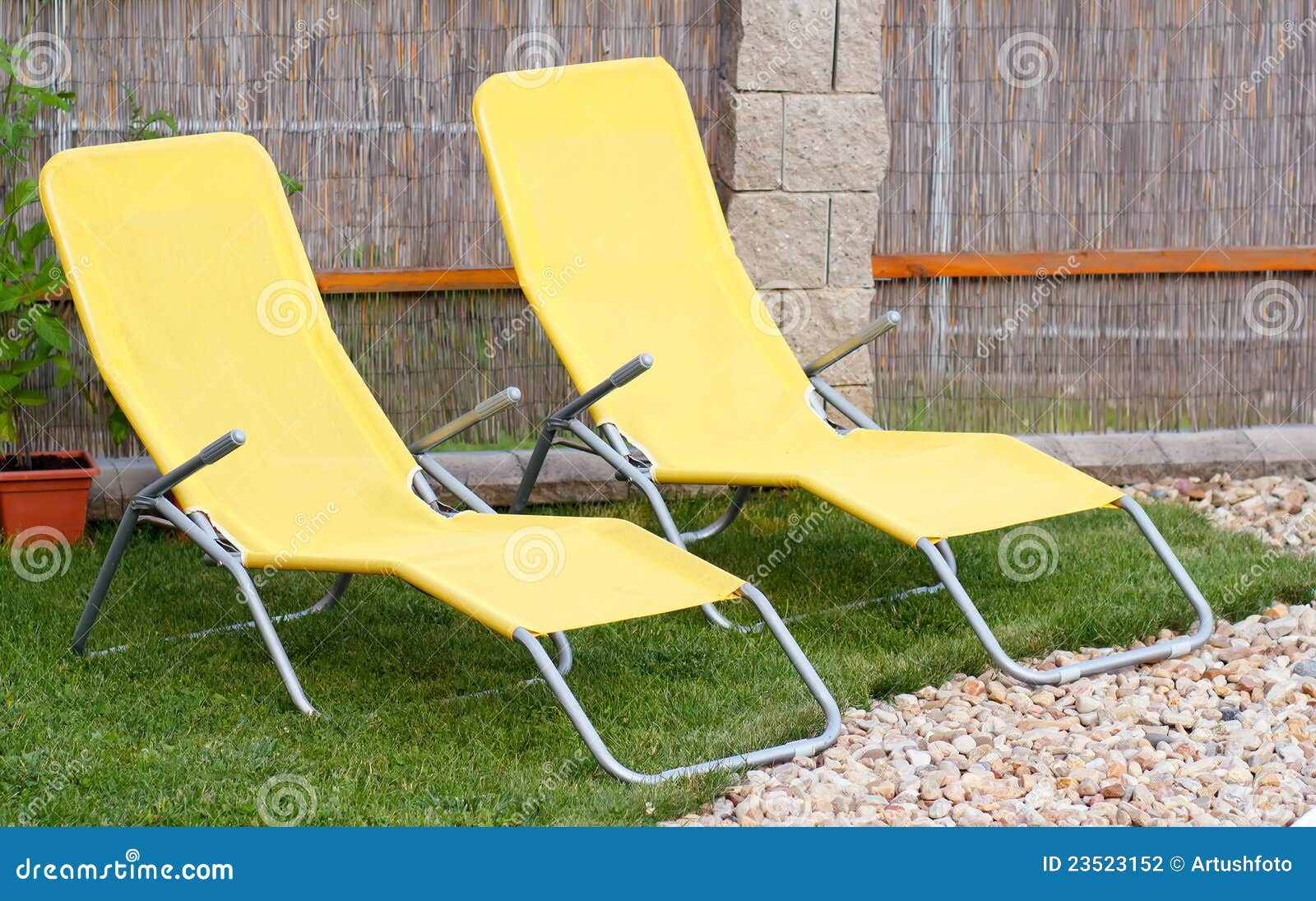 Two Empty Yellow Sun Loungers Stock Photo - Image of relaxation, yard ...