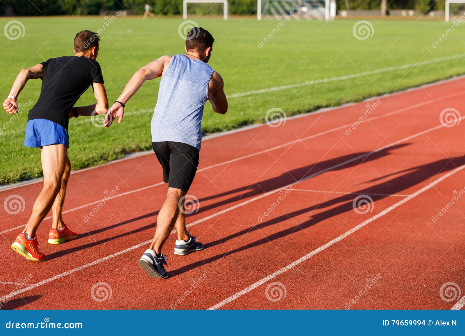 Two Energetic Men Jogging Outdoors on Sunny Day Stock Photo - Image of ...