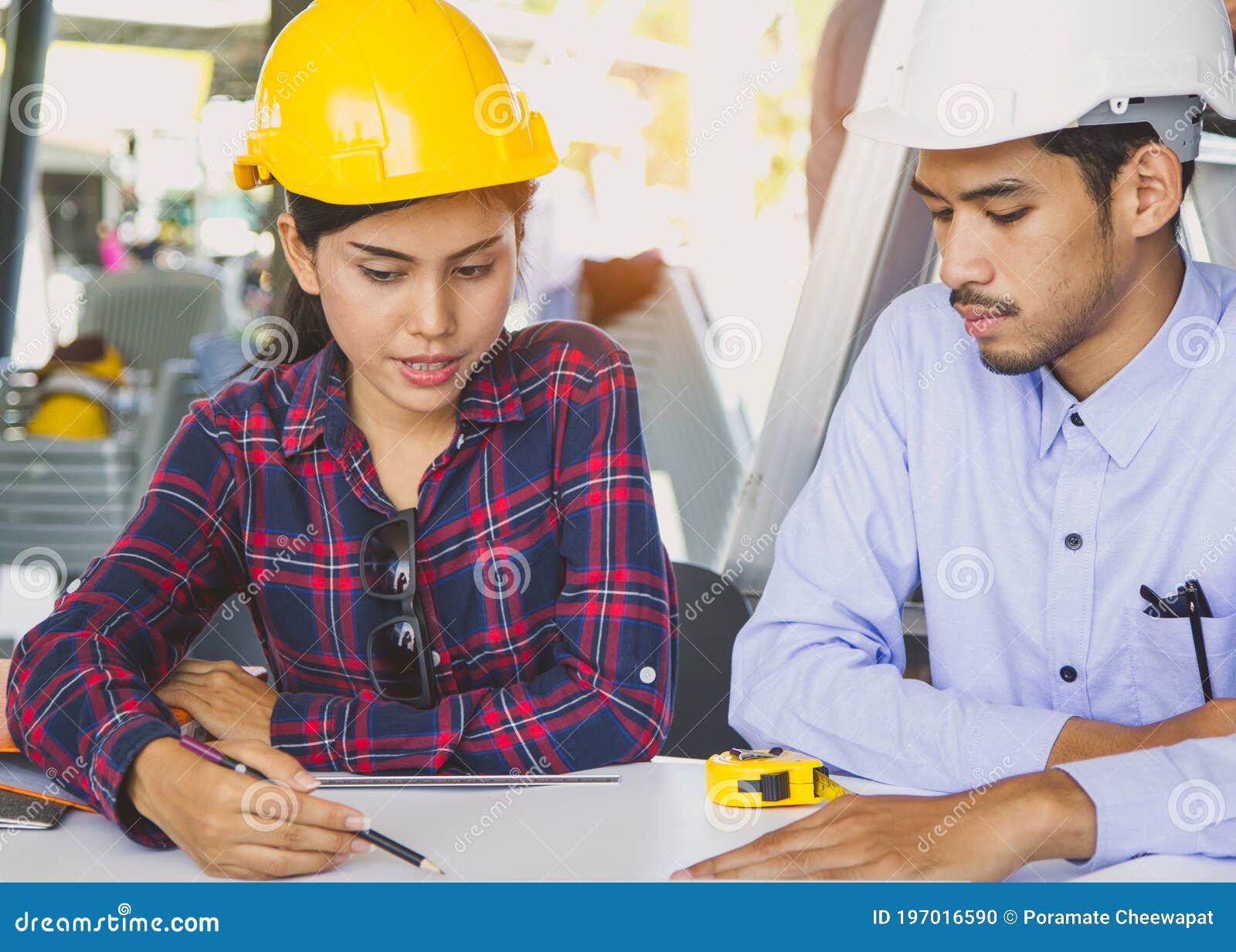 Two Engineer or Architect Working Together on Blueprint in the Office ...