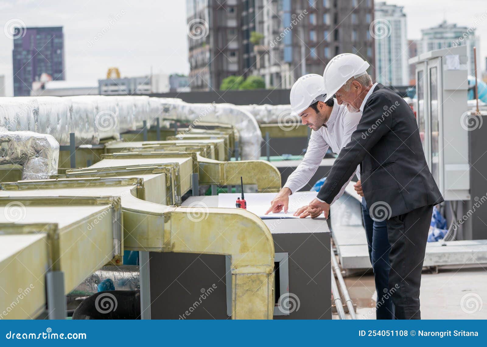 Two Engineer Discuss about Project on Building Plan or Drawing and Stay ...