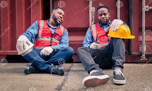 Two Engineer or Foreman Wears PPE Sitting Stress on Container ...