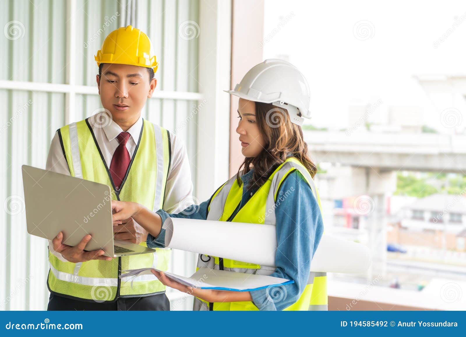 Engineer Male and Female is Discussing on Document Plant Stock Photo ...