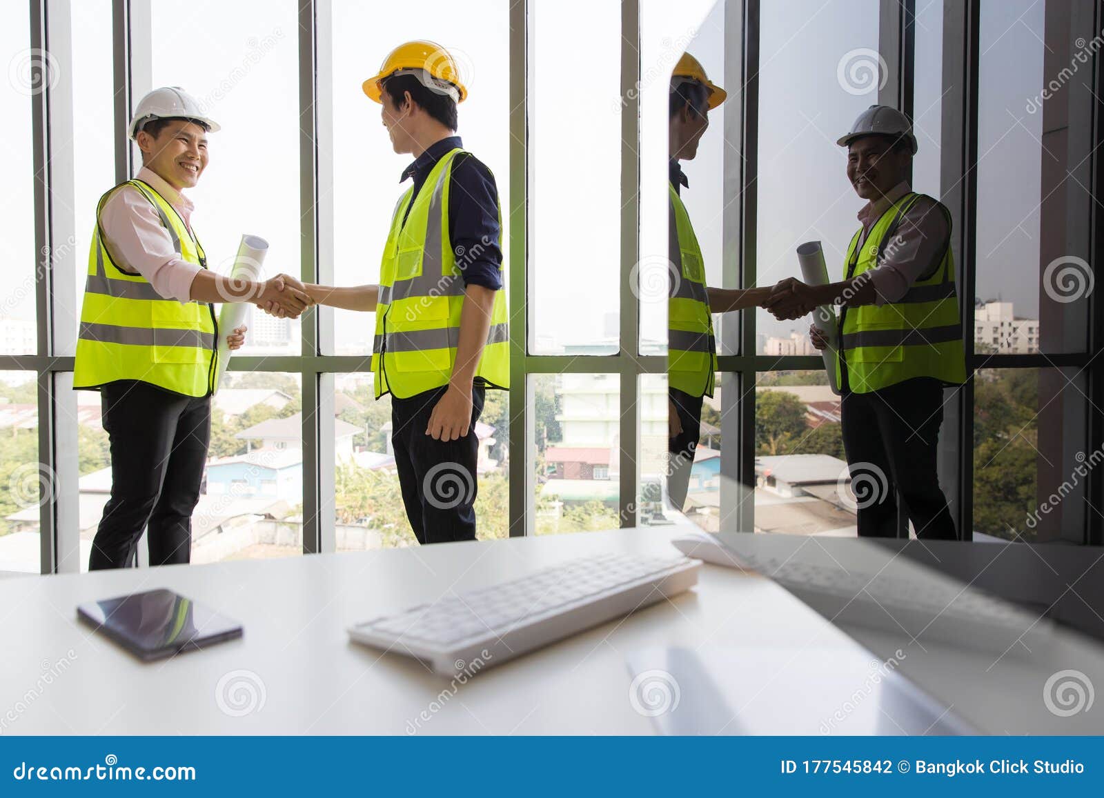 Two engineer reading plan stock photo. Image of office - 177545842
