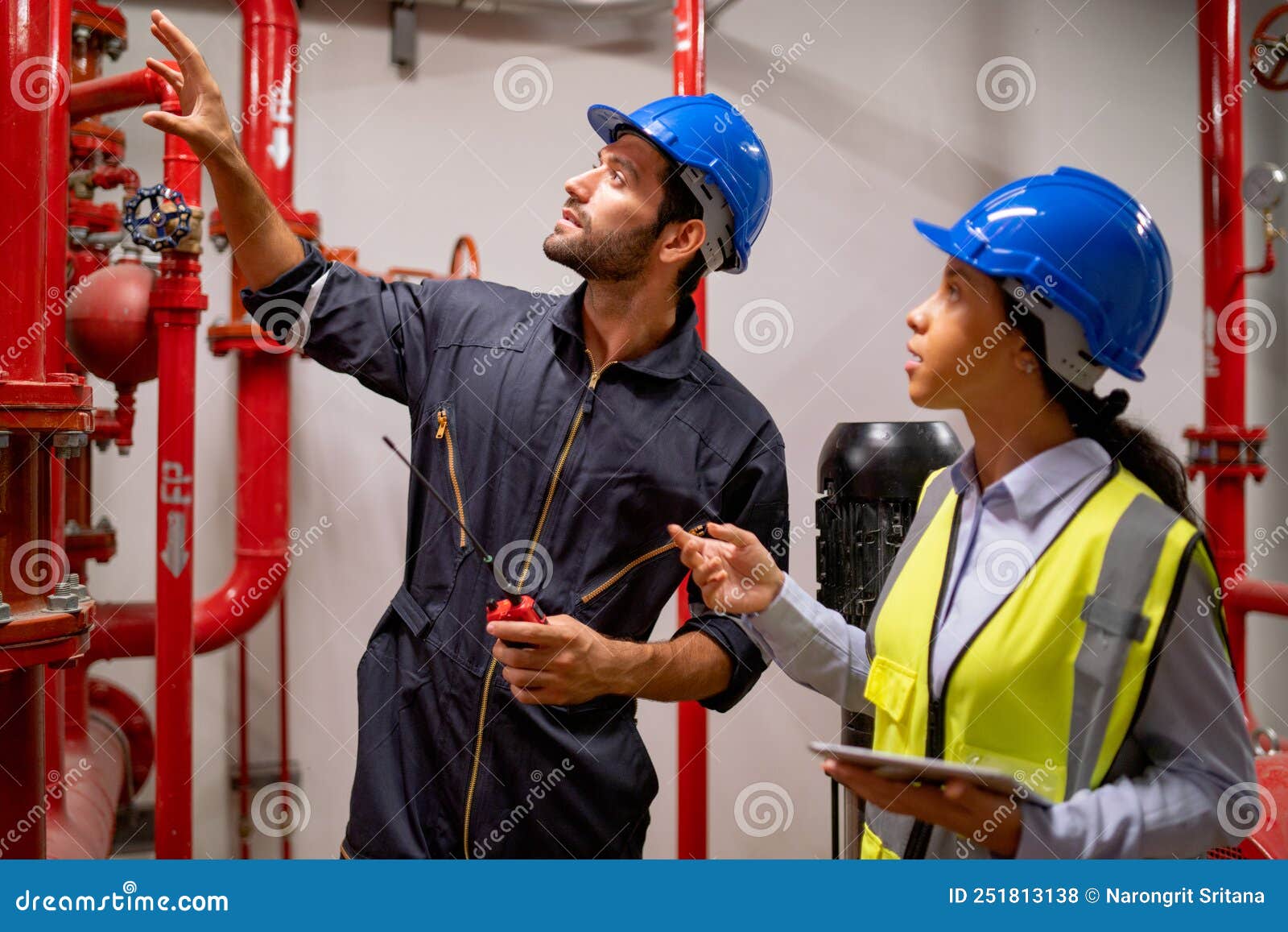 Two Engineer or Technician Worker Discuss about Red Pipe System in the ...