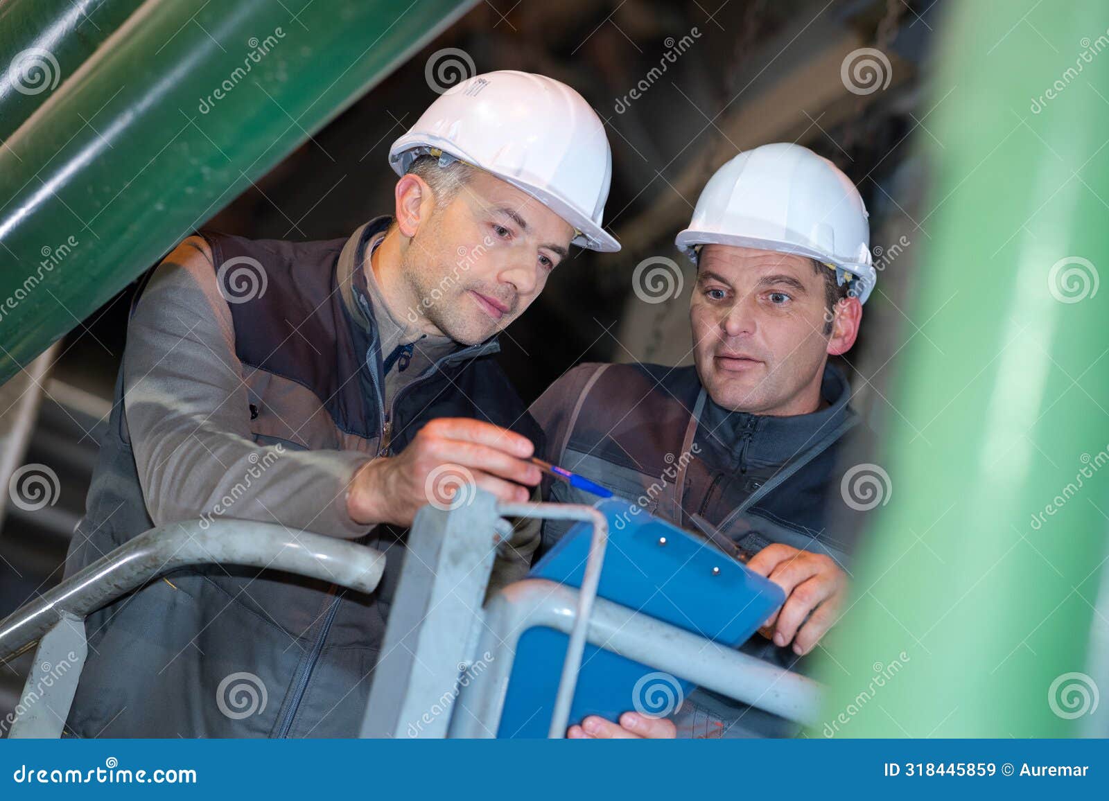 Two Engineer Worker Working Together with Safety Uniform Stock Image ...