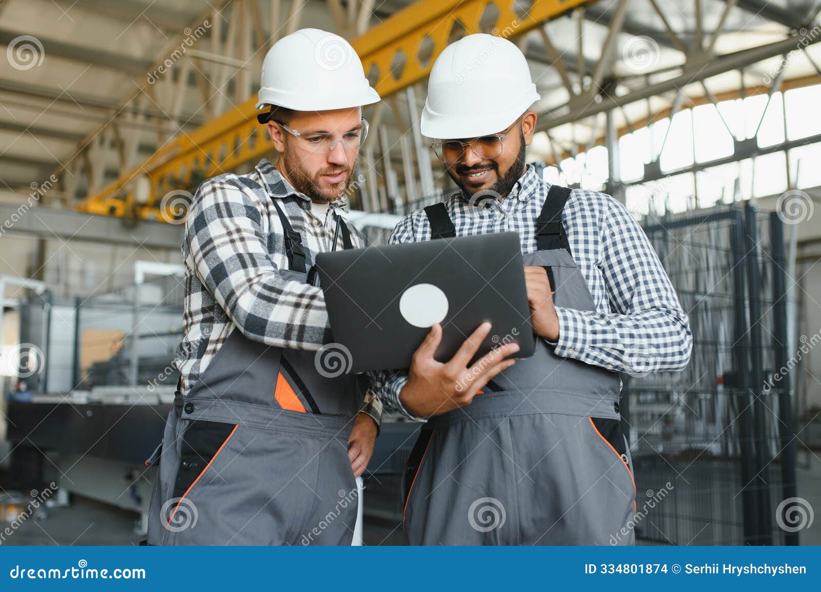 Two Engineer Worker Working Together with Safety Uniform and White ...