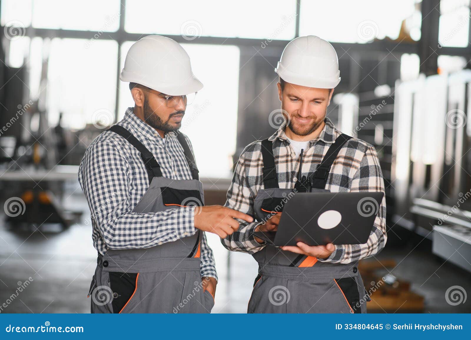 Two Engineer Worker Working Together with Safety Uniform and White ...