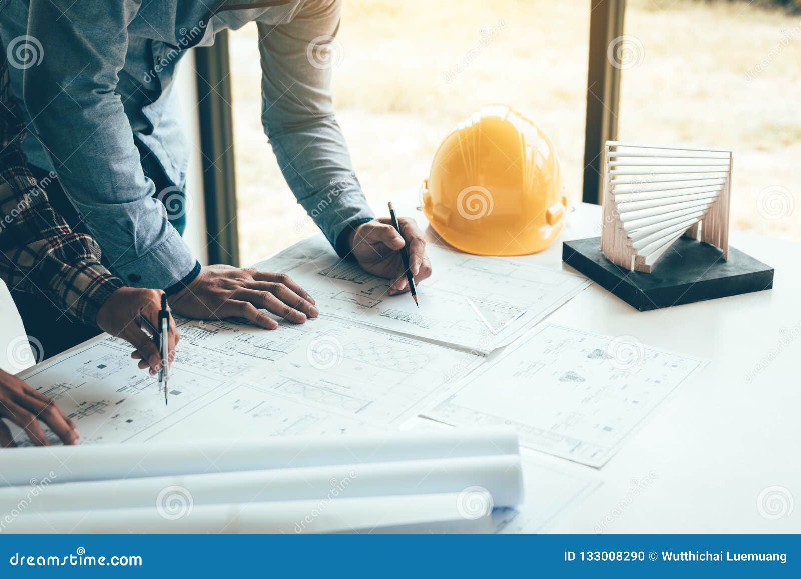 Two Engineering Man or Co-workers Working on a Project and Discussing ...