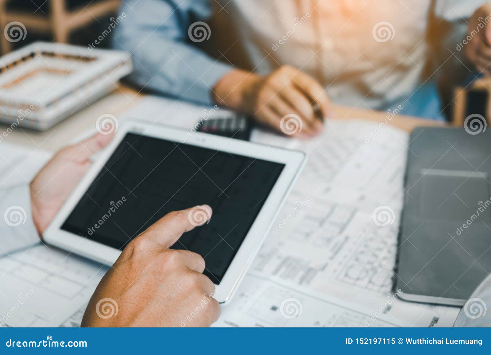 Two Engineering Working Together and Using Digital Tablet Looking ...