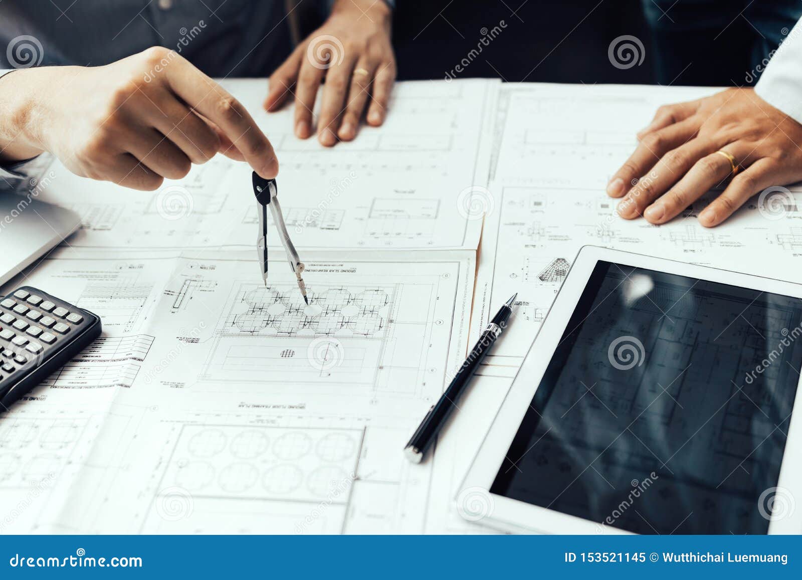 Two Engineering Working Together and Using Digital Tablet Looking ...