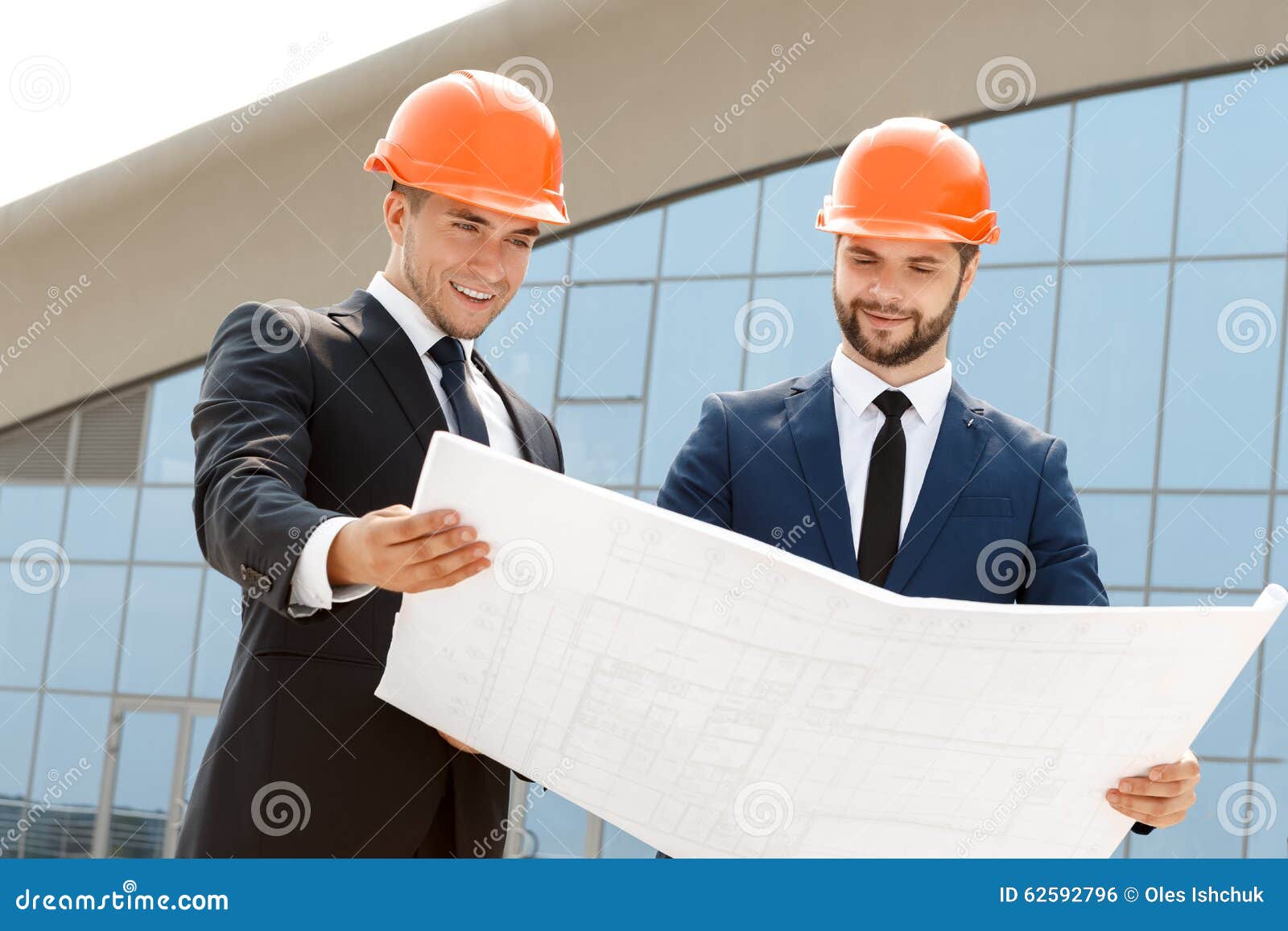 Two Engineers Checking the Architectural Plans Stock Photo - Image of ...