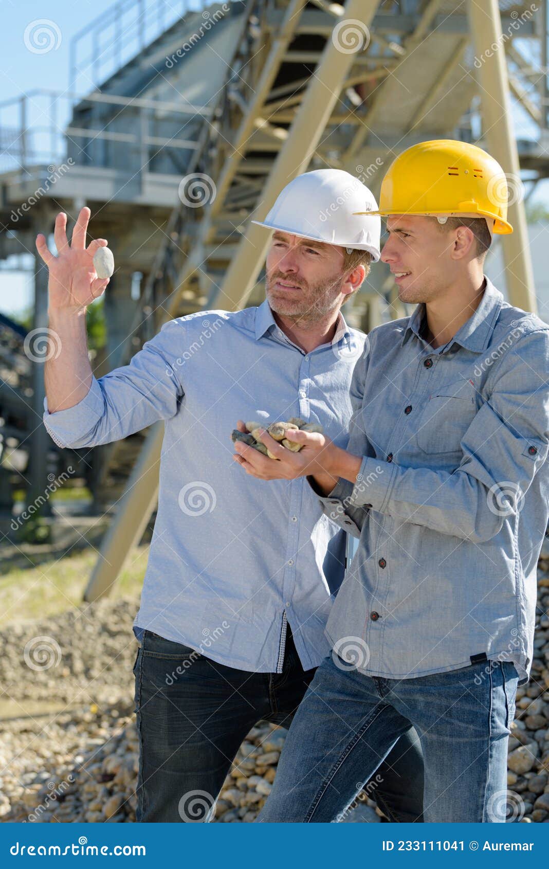 Two Engineers Checking Something Outdoors Stock Image - Image of report ...