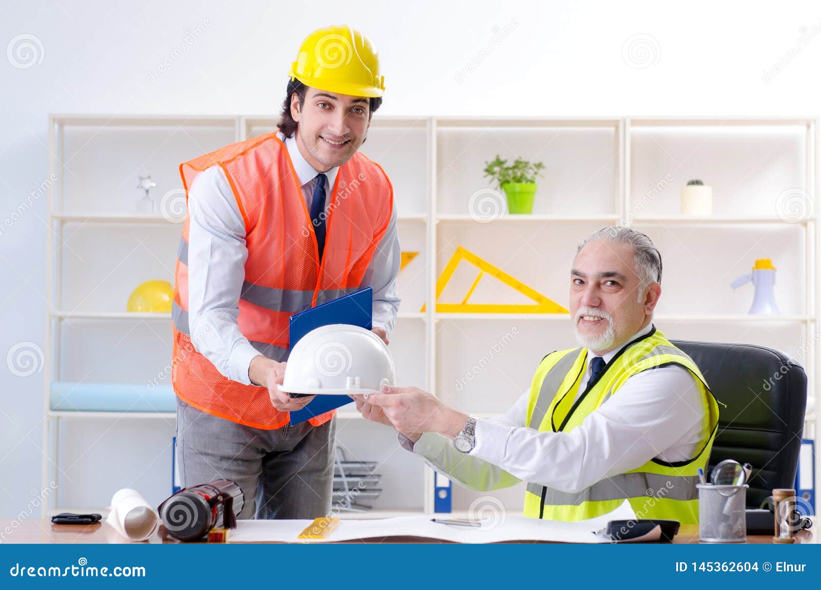 The Two Engineers Colleagues Working Under Project Stock Photo - Image ...
