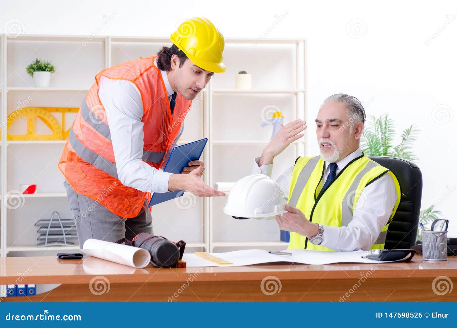 The Two Engineers Colleagues Working Under Project Stock Photo - Image ...