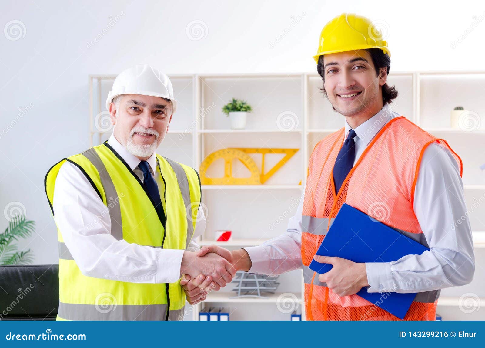 The Two Engineers Colleagues Working Under Project Stock Photo - Image ...