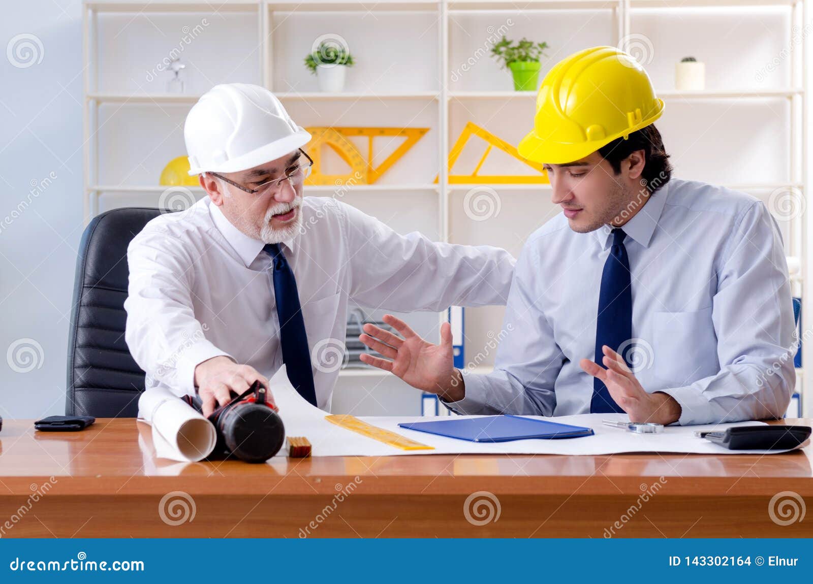 The Two Engineers Colleagues Working Under Project Stock Photo - Image ...