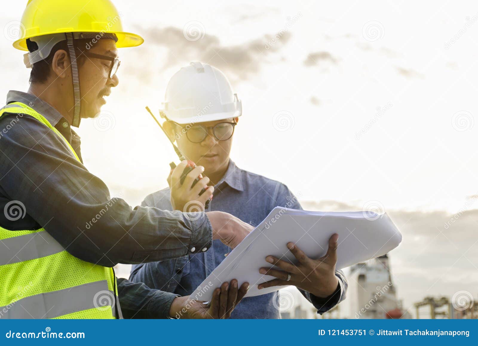 Two Engineers are in Control Using Radio Communication Tools and Stock ...