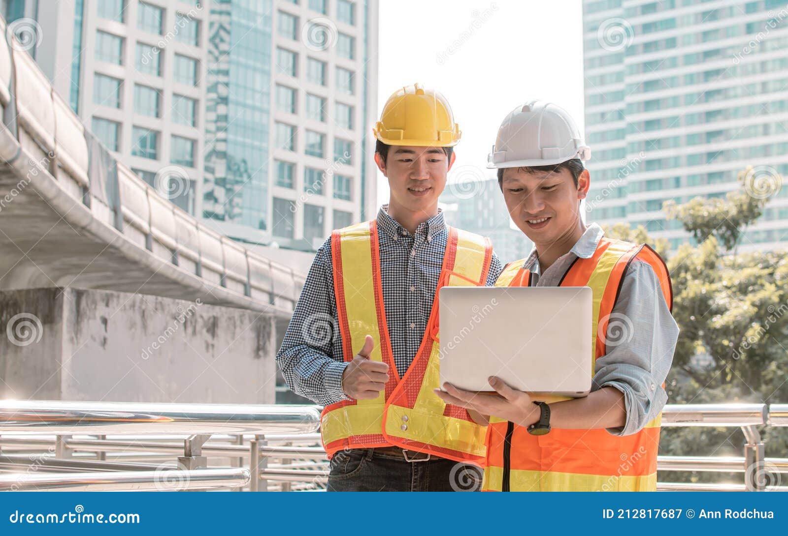 Two Engineers Discuss about the Projects and Construction Site Stock ...