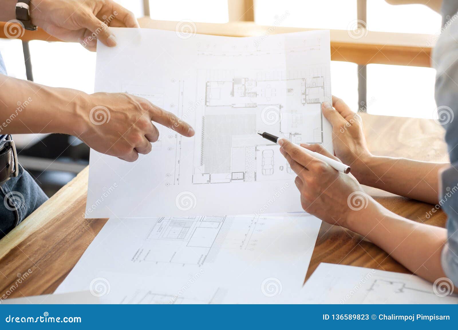 Two Engineers Discussion on Architectural Project at Construction Site ...