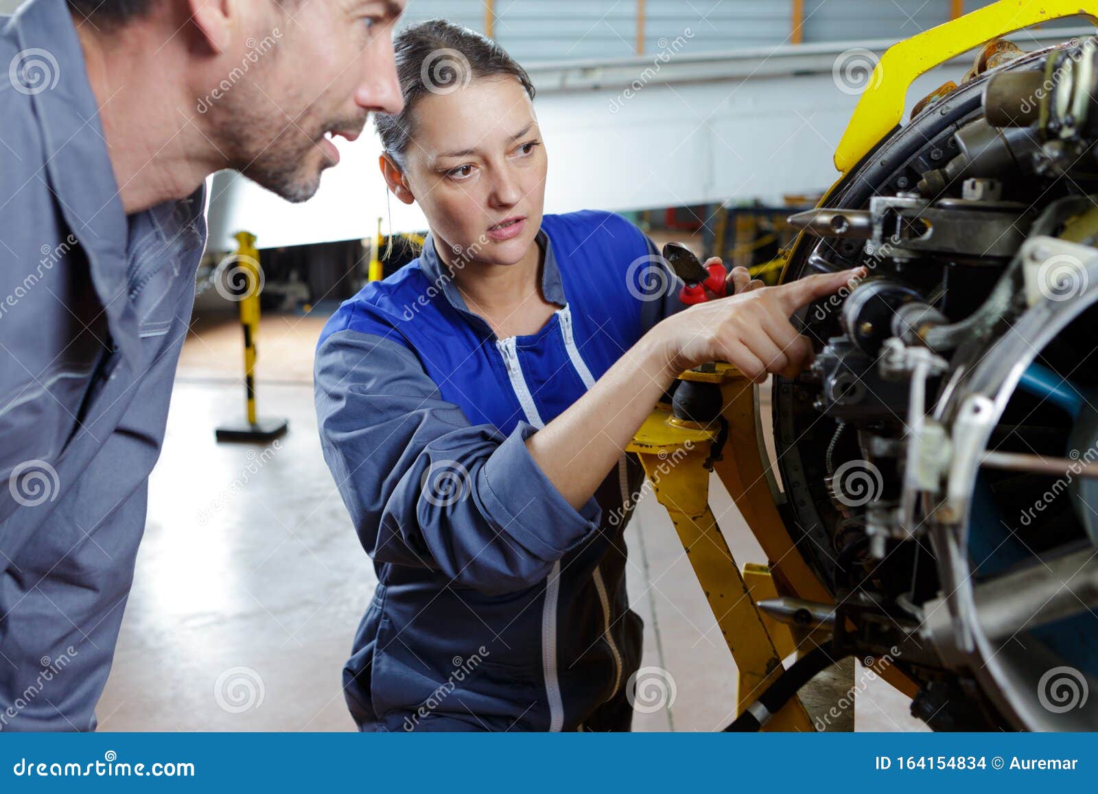Two Engineers Fixing Engine Stock Photo - Image of industrial, flight ...