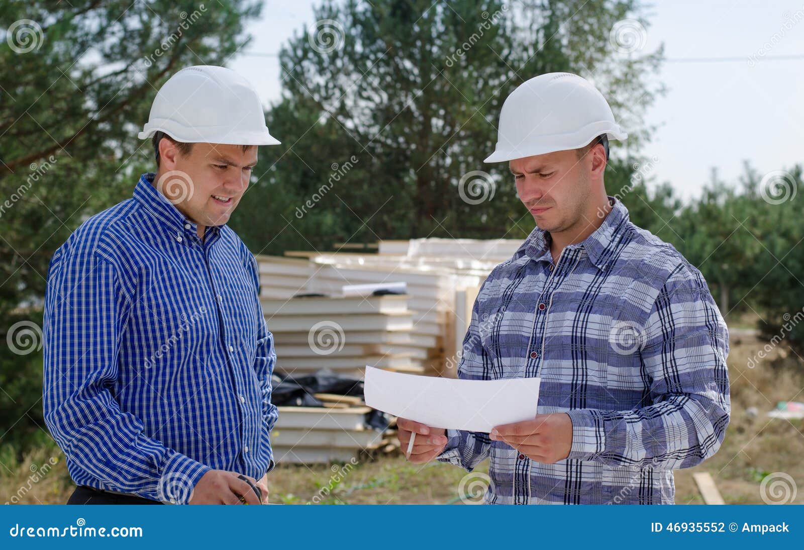 Two Engineers Having a Discussion on Site Stock Photo - Image of ...