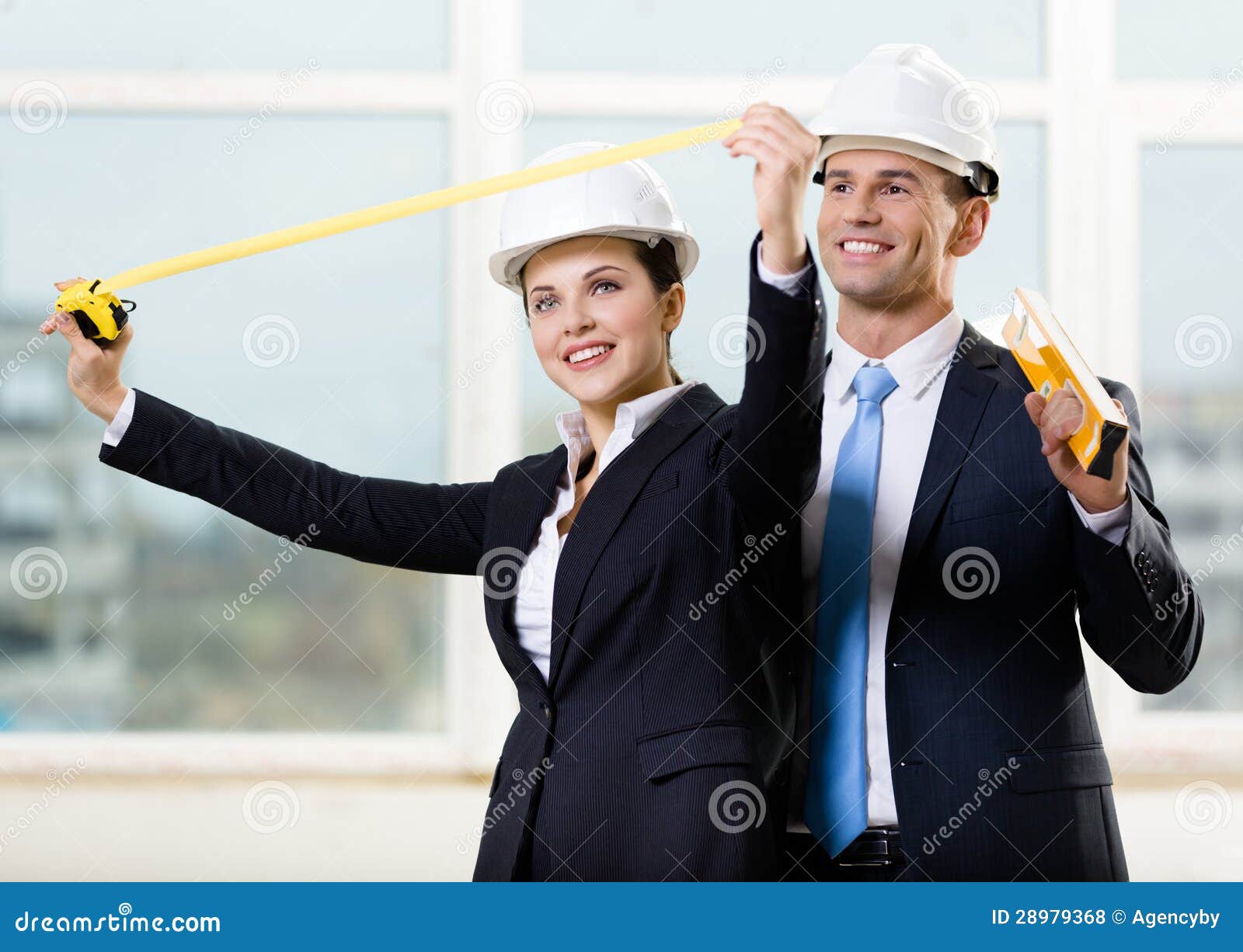 Two Engineers Keeping Level and Tape Measure Stock Photo - Image of ...