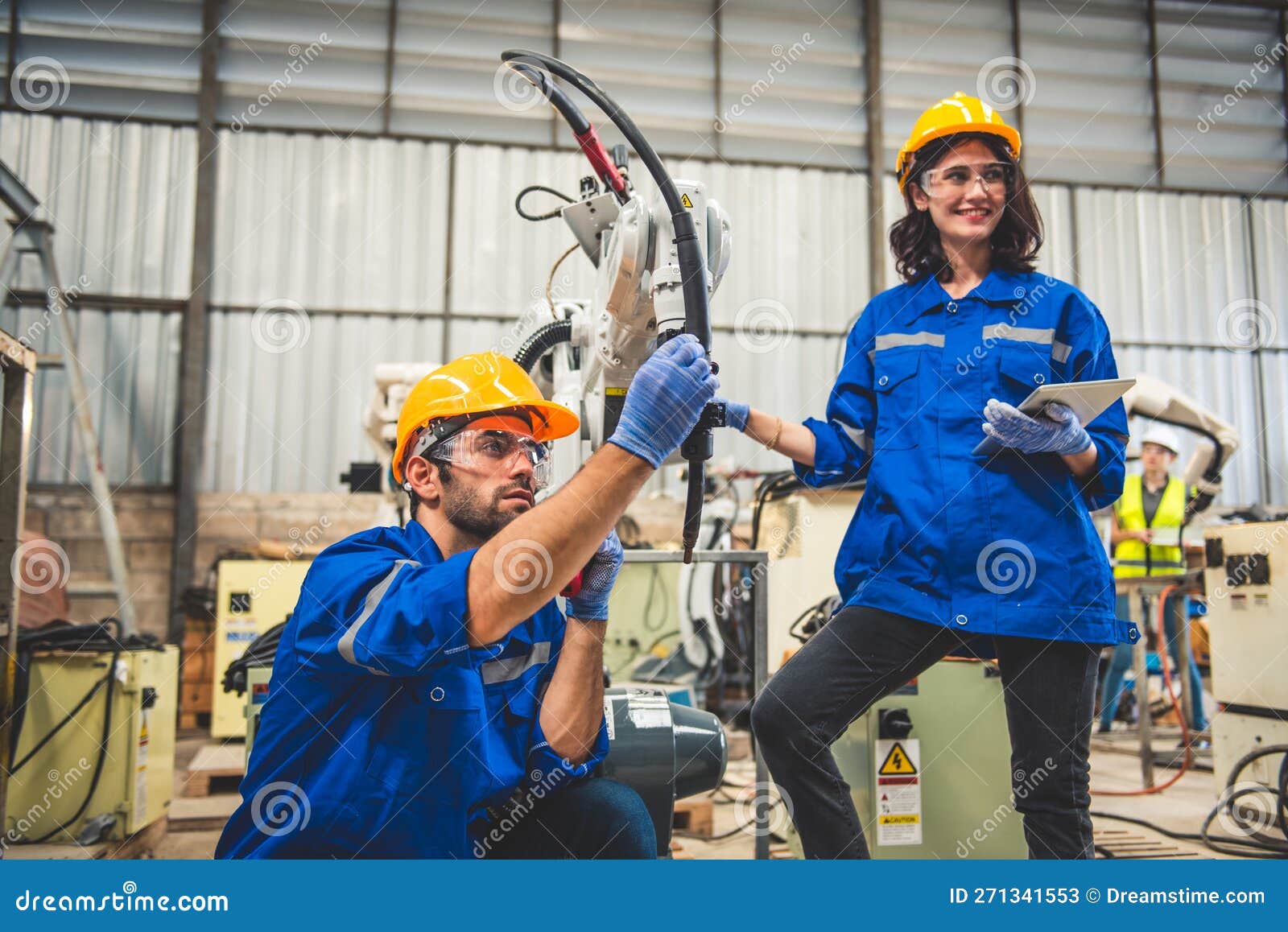 Two Engineers Mechanic Using Computer Controller Robotic Arm for ...