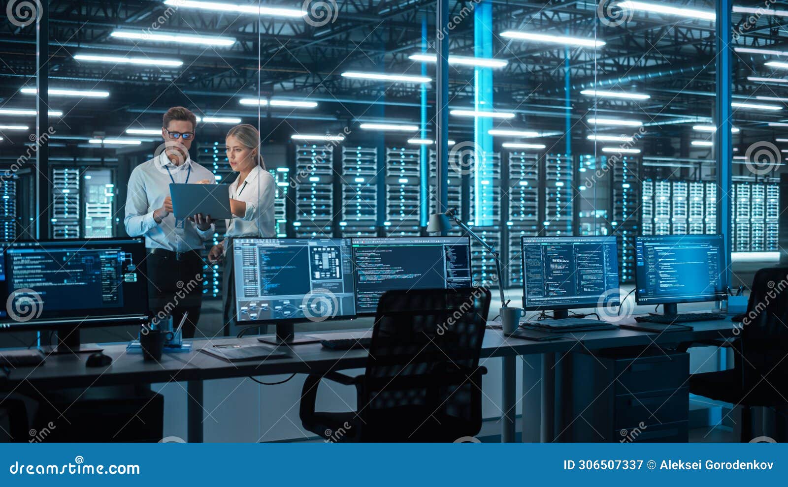 Two it Engineers Standing in Working Data Center. they Use Laptop while ...