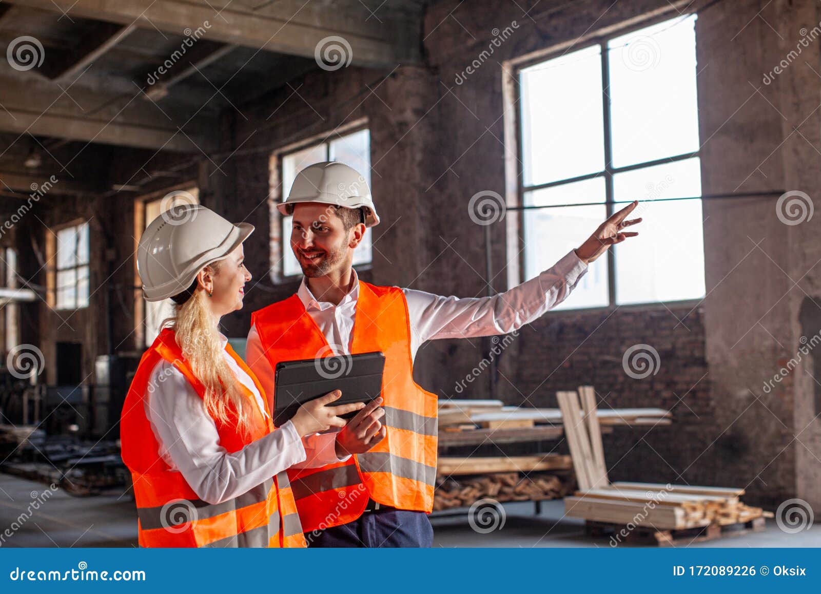 Two Engineers Talking and Discussing New Construction Project Stock ...