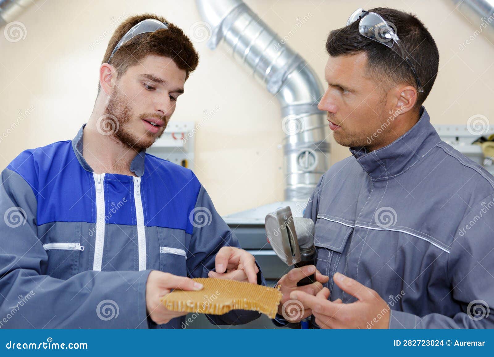 Two Engineers Talking and Pointing To Problem Stock Photo - Image of ...
