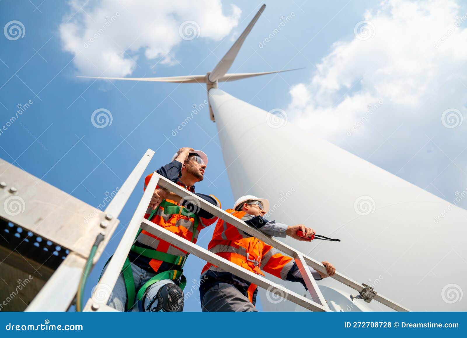 Two Engineers or Technician Workers Stand on Base of Big Windmill or ...