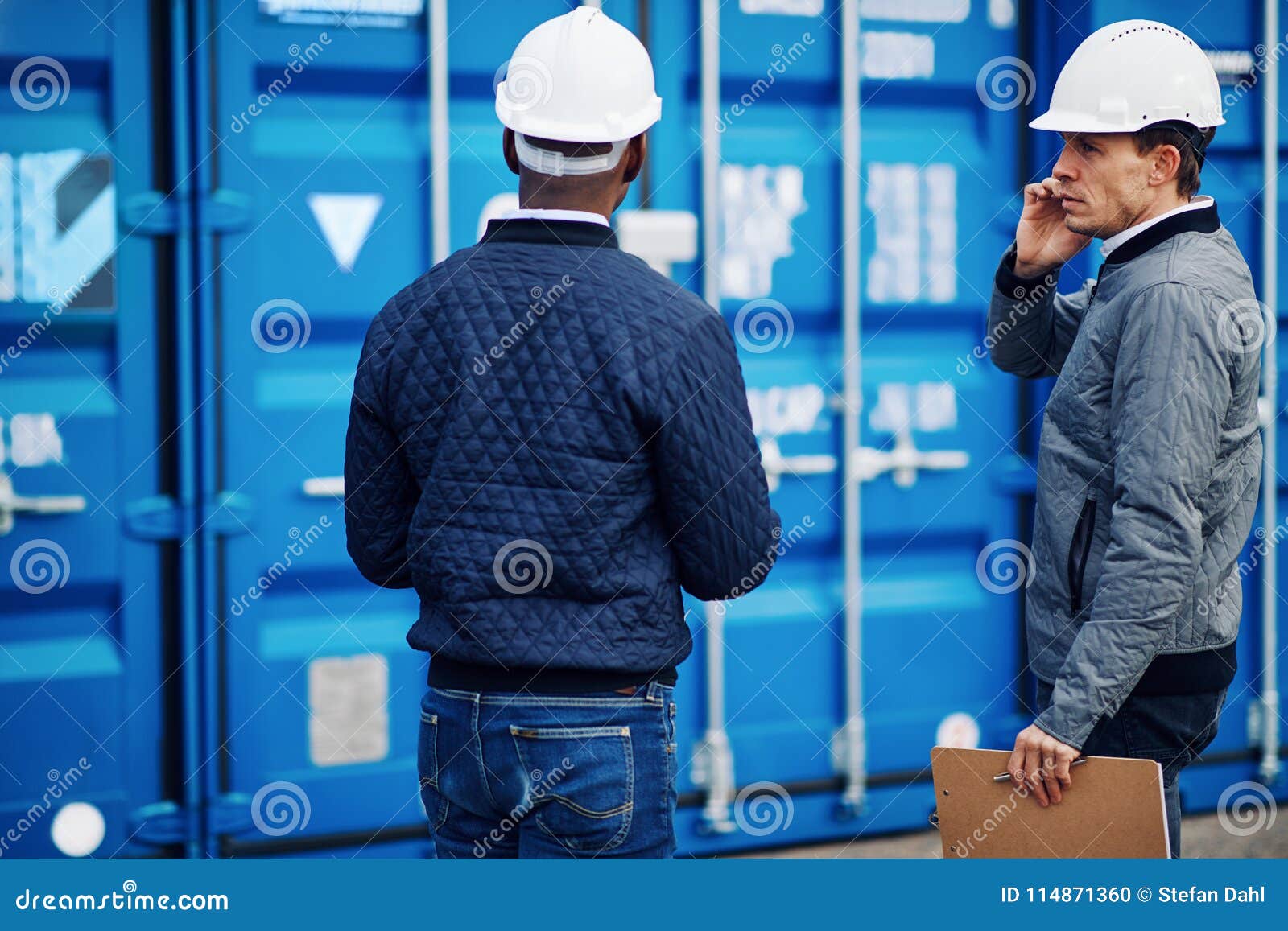 Two Engineers Tracking Containers in a Shipping Yard Stock Photo ...