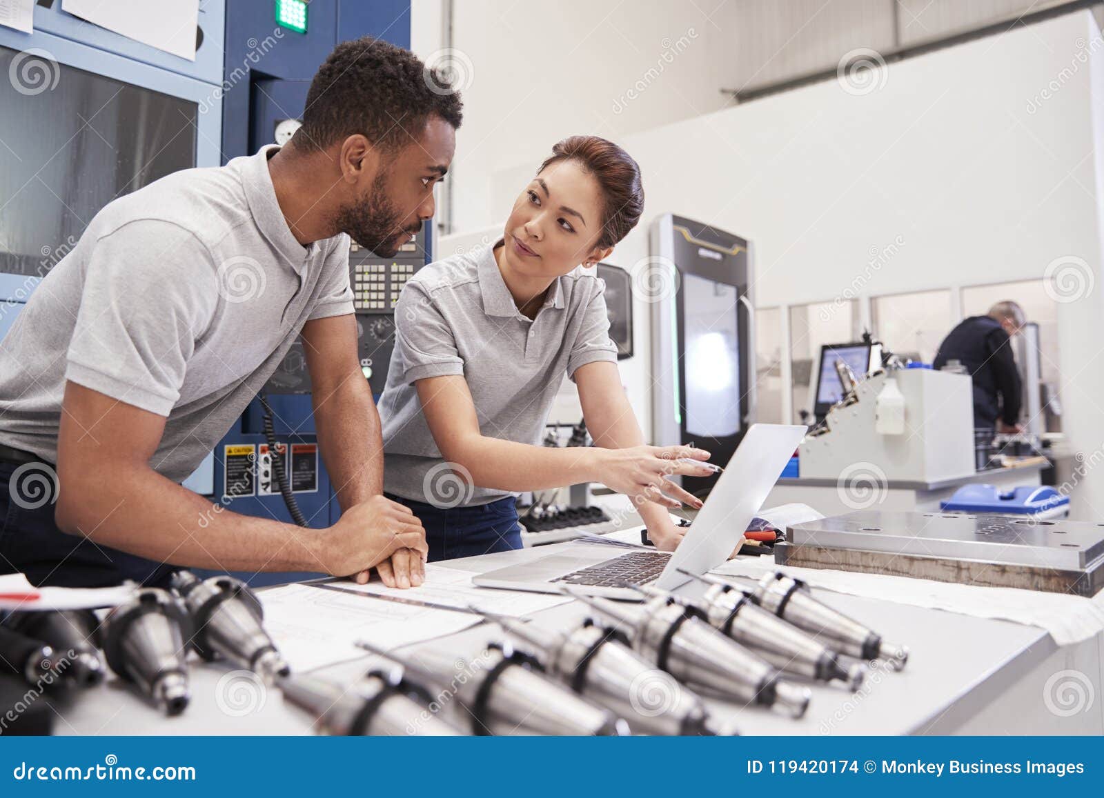 Two Engineers Using CAD Programming Software on Laptop Stock Photo ...