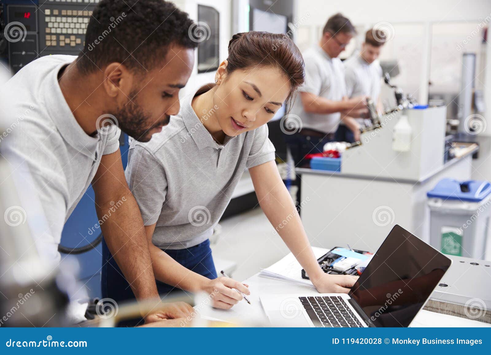 Two Engineers Using CAD Programming Software on Laptop Stock Photo ...