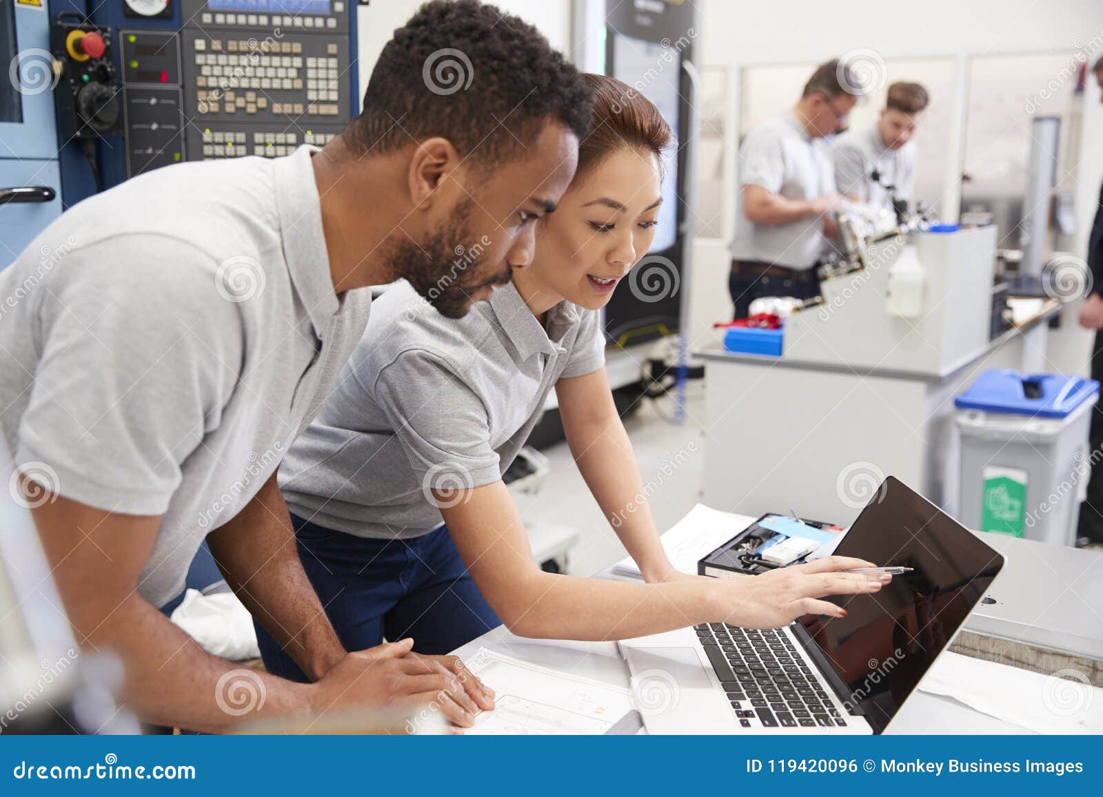 Two Engineers Using CAD Programming Software on Laptop Stock Photo ...