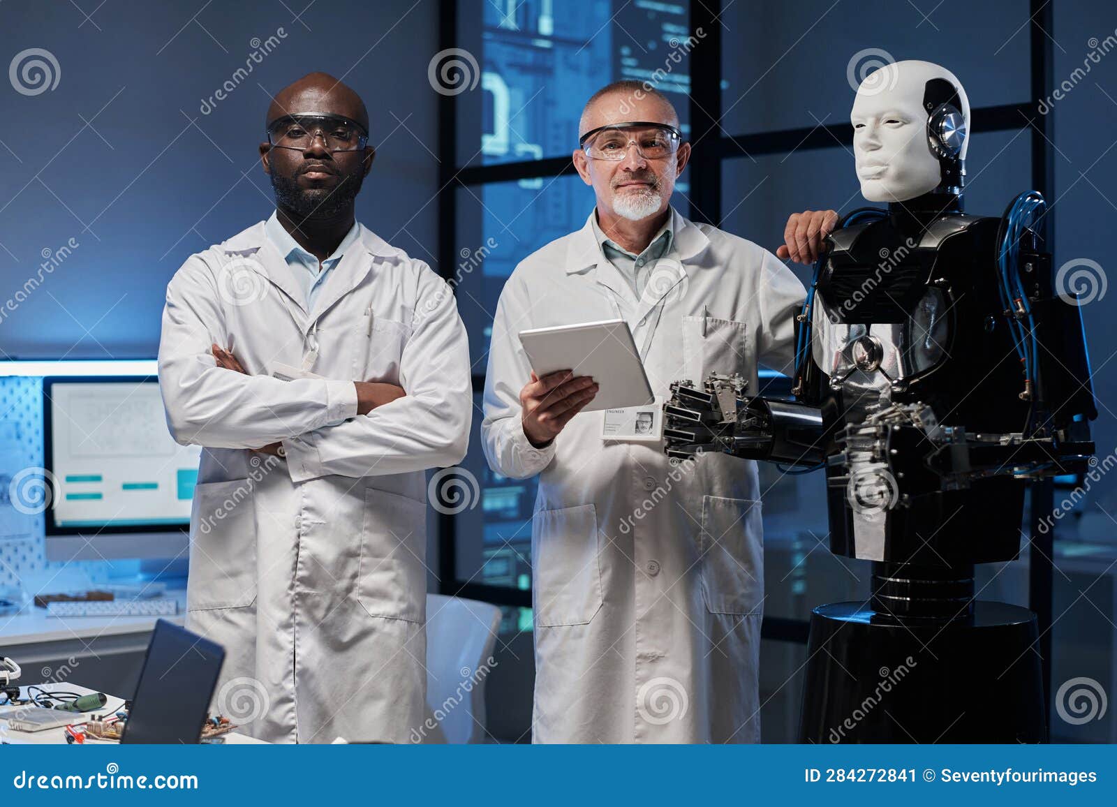 Two Engineers in White Coats Working in the Lab Stock Image - Image of ...