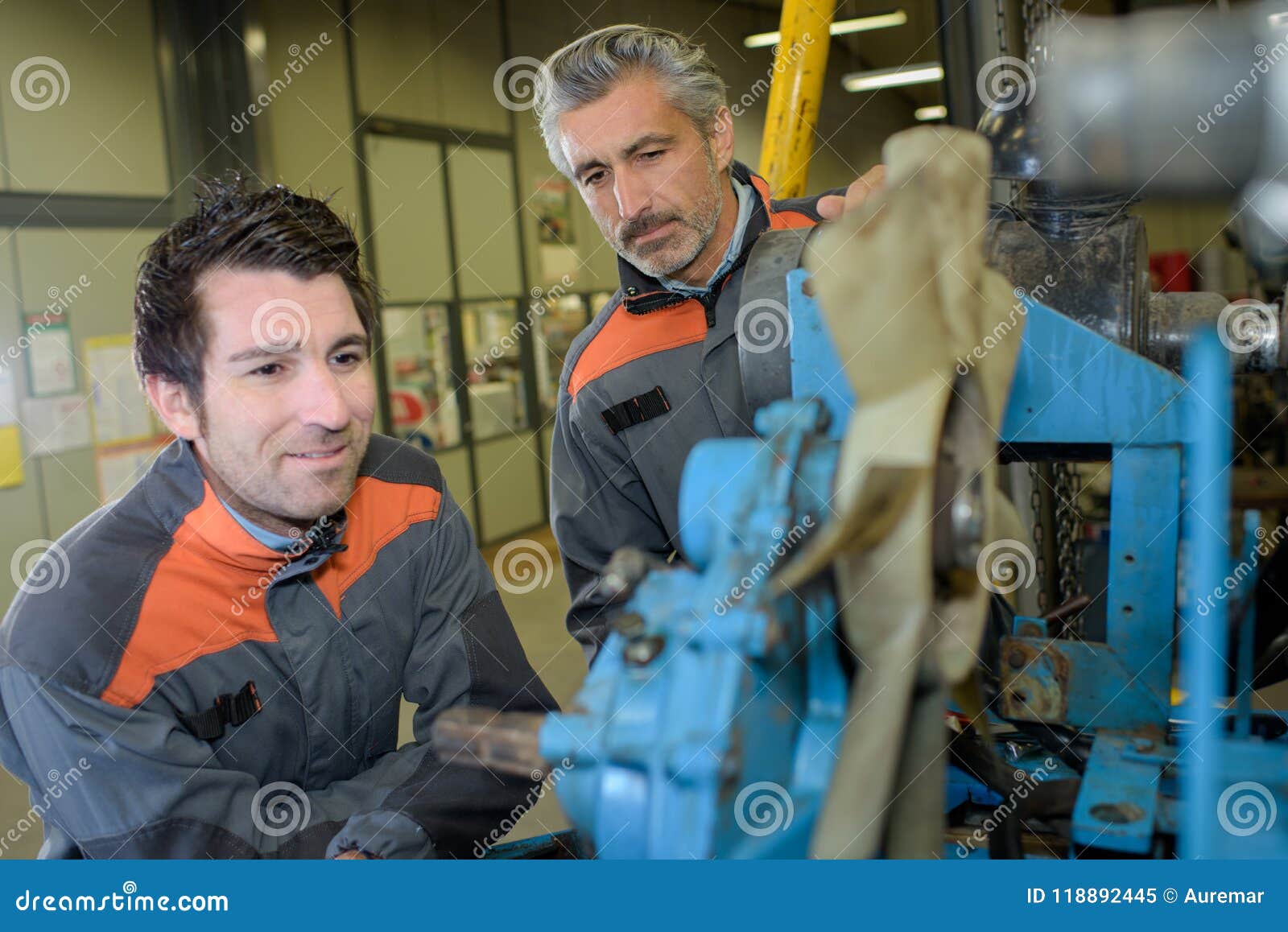 Two engineers at work stock image. Image of workshop - 118892445