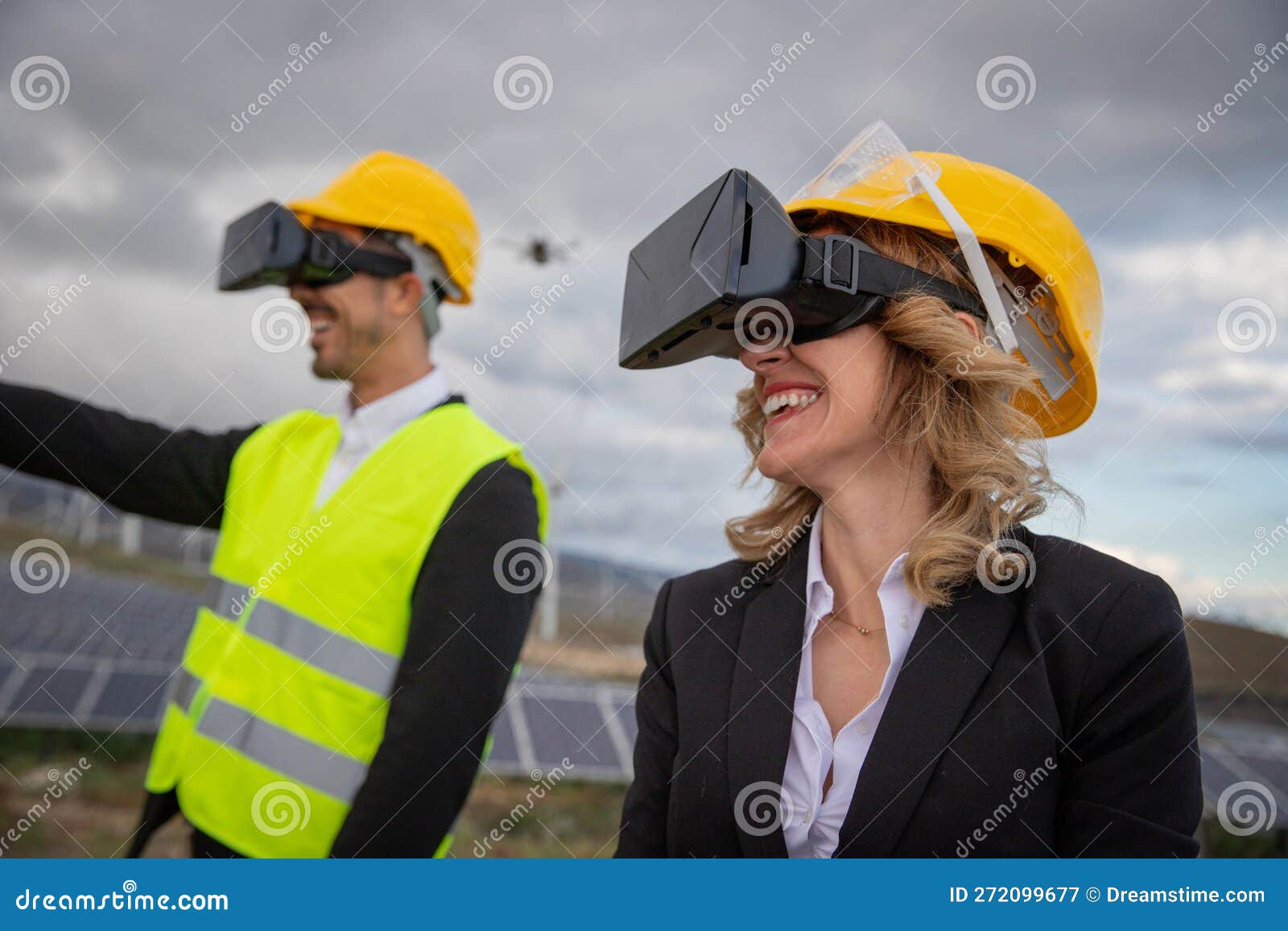 Two Engineers Work Using Virtual Reality Headsets at a Solar Power ...