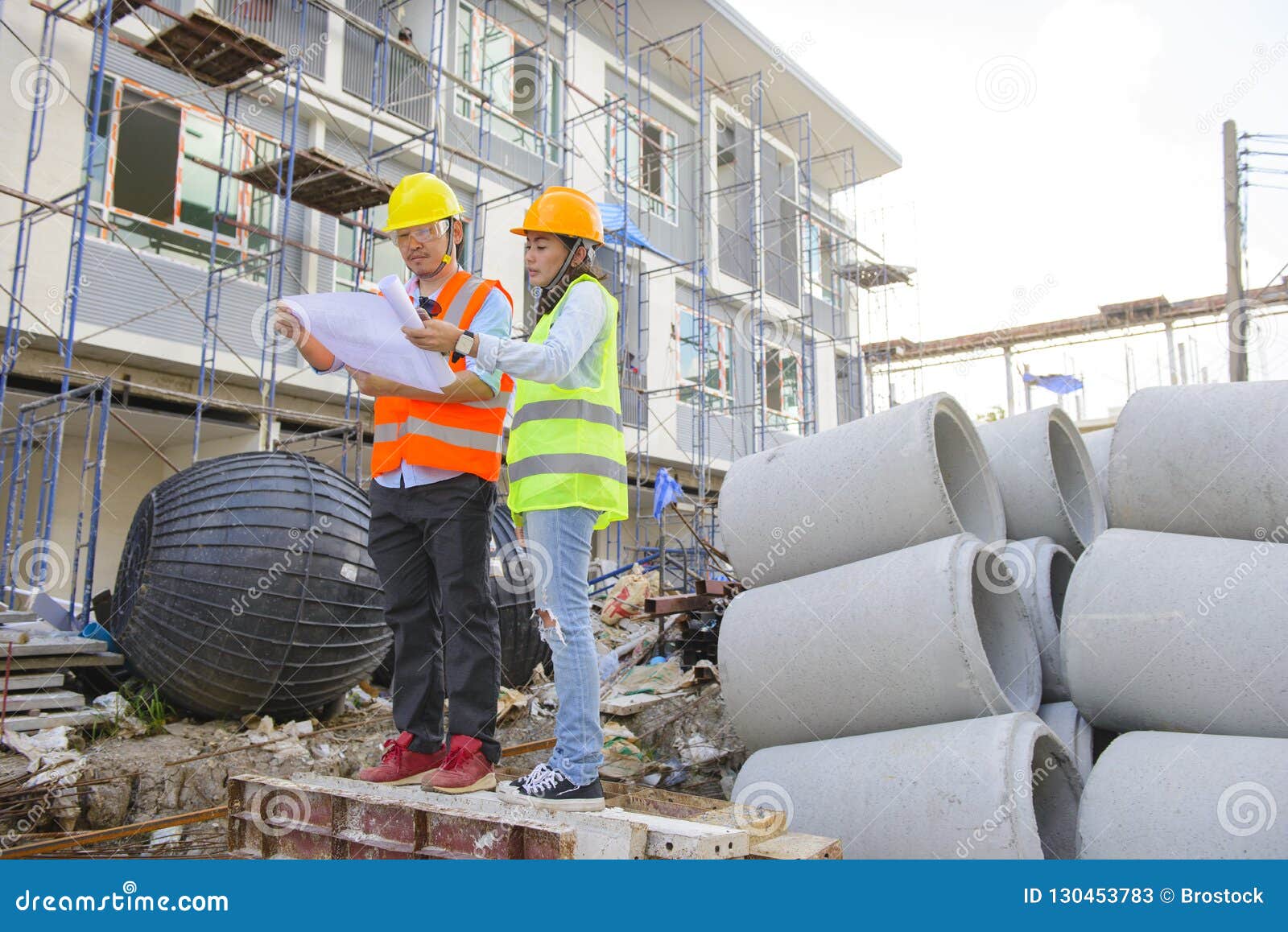 Two Engineers Working Together at Construction Site Stock Image - Image ...