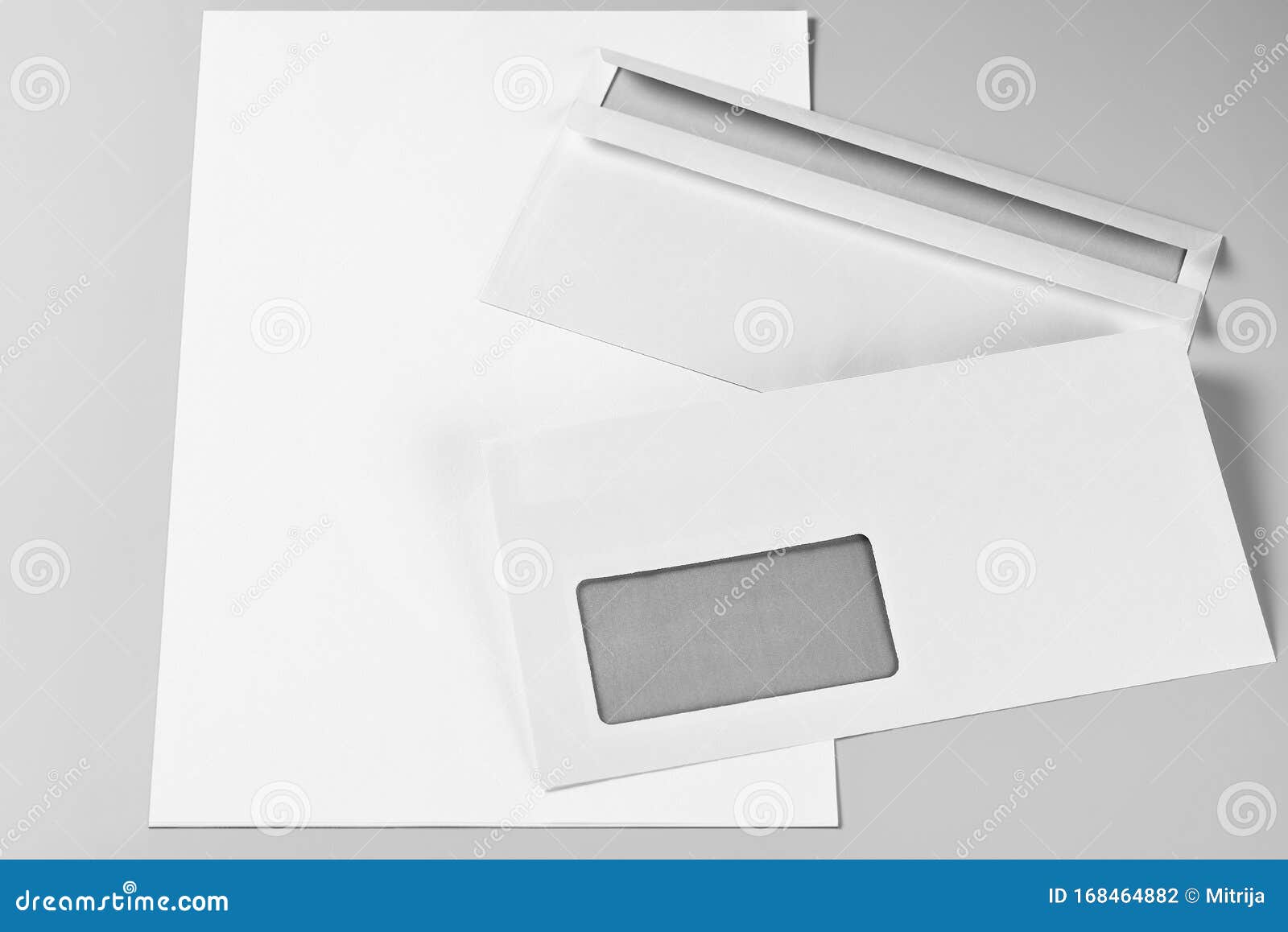 Two Envelopes Over Blank Sheets of Paper Stock Photo - Image of folded ...