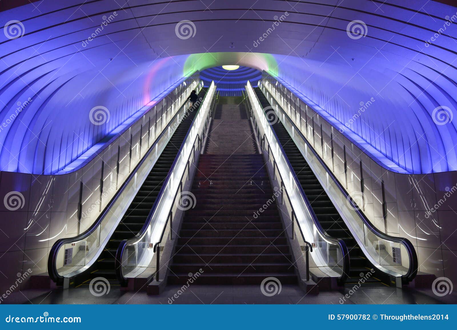 Two Escalators with Blue Light Overhead Stock Photo - Image of office ...