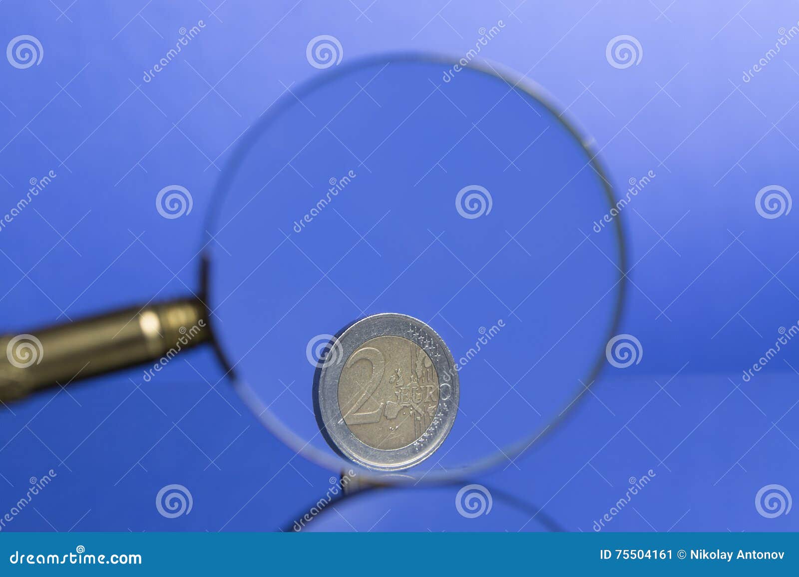 Two Euro Coin on Blue Background through Magnifying Glass with Nice ...