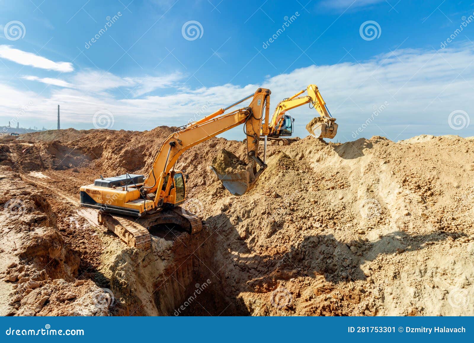 Two Excavator are Digging Soil in the Construction Site on Sky ...