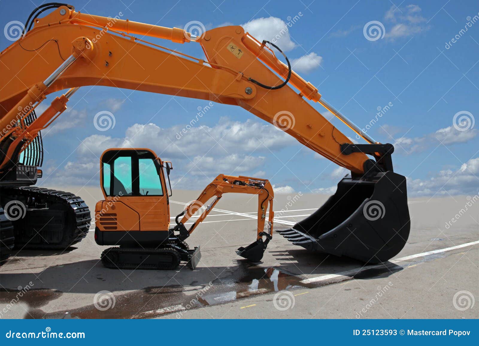 Two Excavators on a Concrete Platform Stock Image - Image of background ...