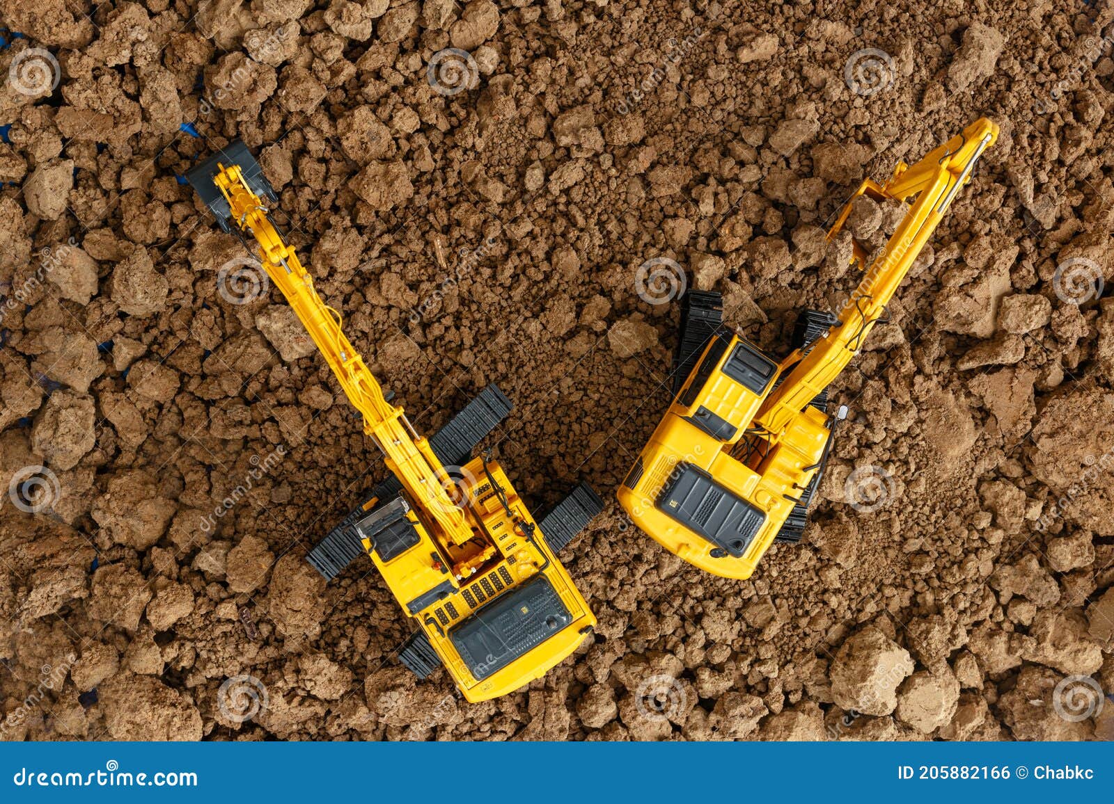 Two Excavators Loader are Digging the Soil in the Construction Site ...