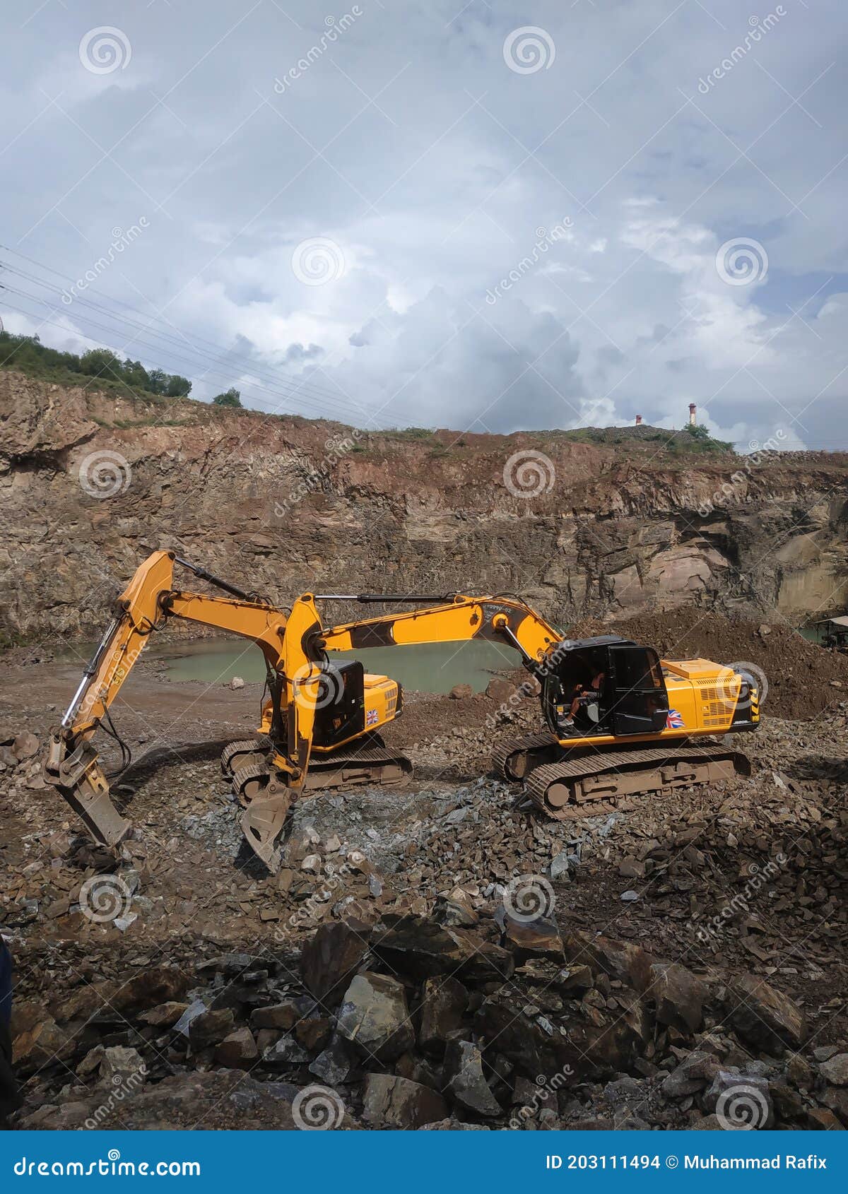 Two Excavators are Running Rock Mining Activities Stock Photo - Image ...