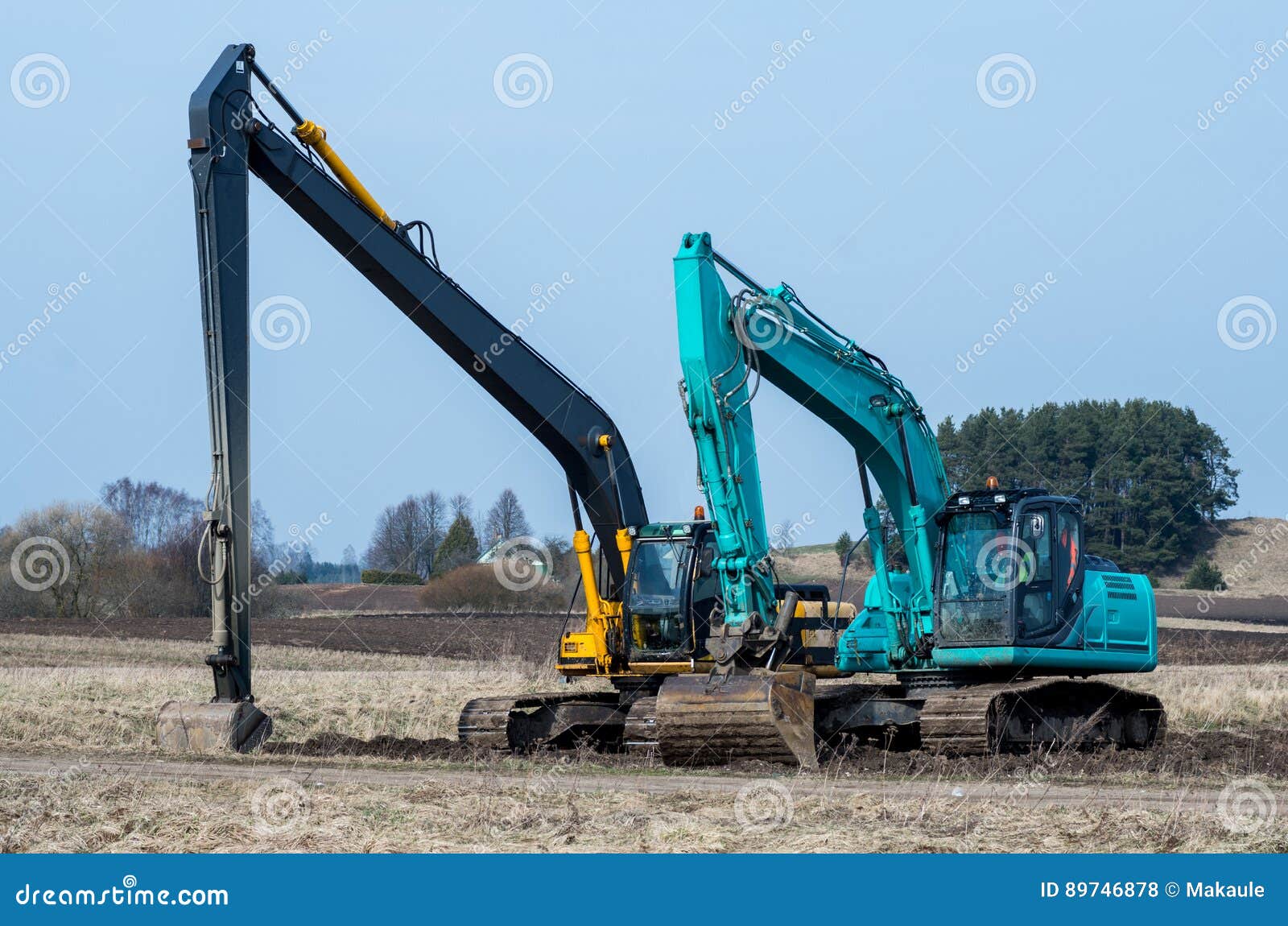 Two excavators stock photo. Image of earth, soil, construction - 89746878